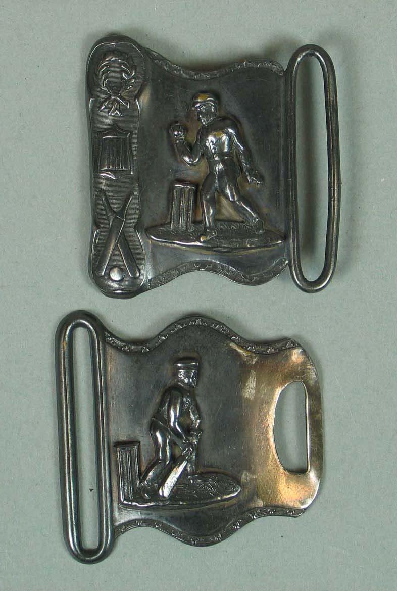 Two piece metal belt buckle, featuring images of cricketers c1865 ...